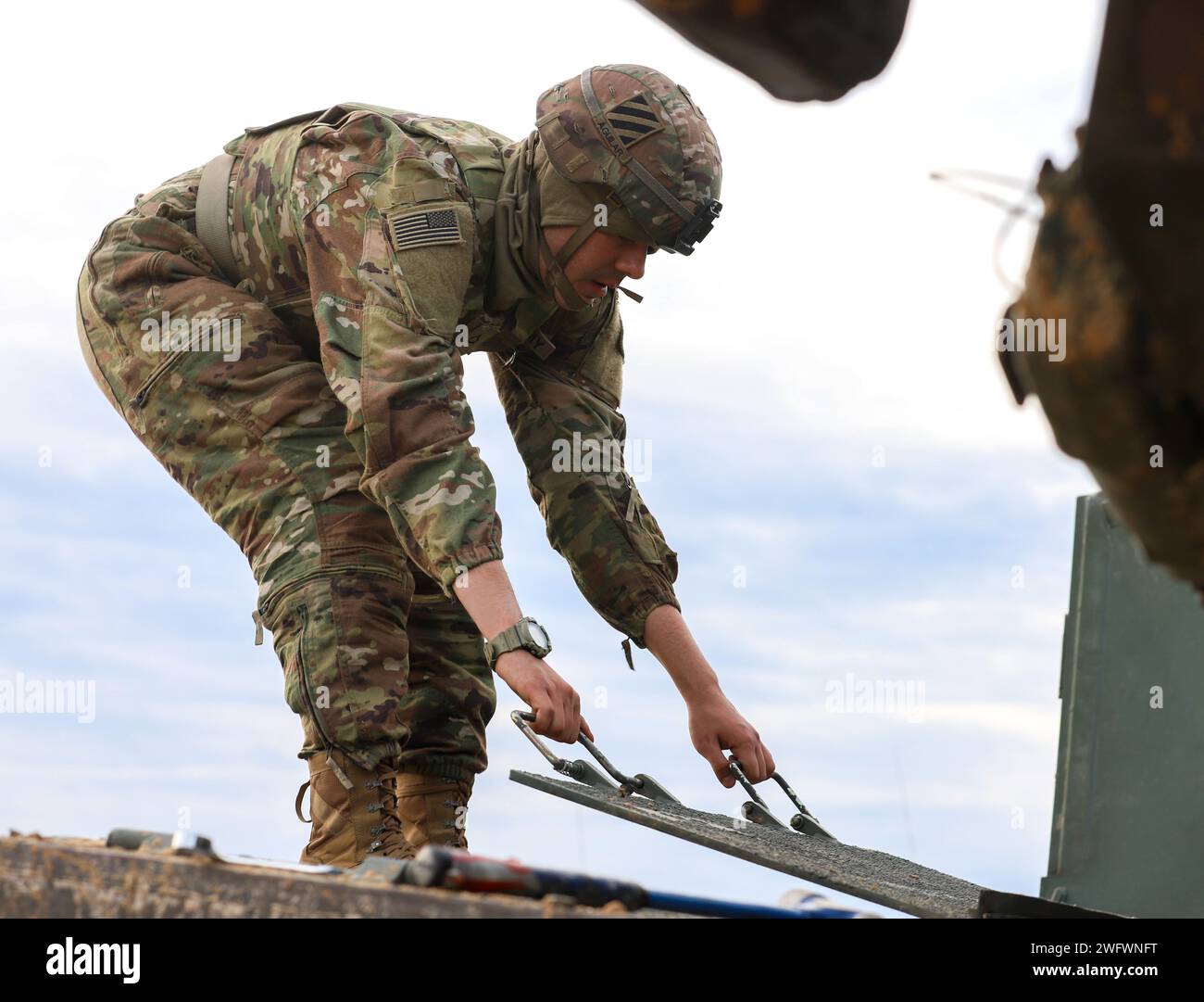 U.S. Army Pfc. Pablo Aguilar, a tank operator with 1st Battalion, 64th ...