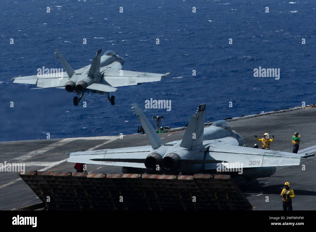 Two F/A-18E Super Hornets, attached to the "Tomcatters" of Strike ...