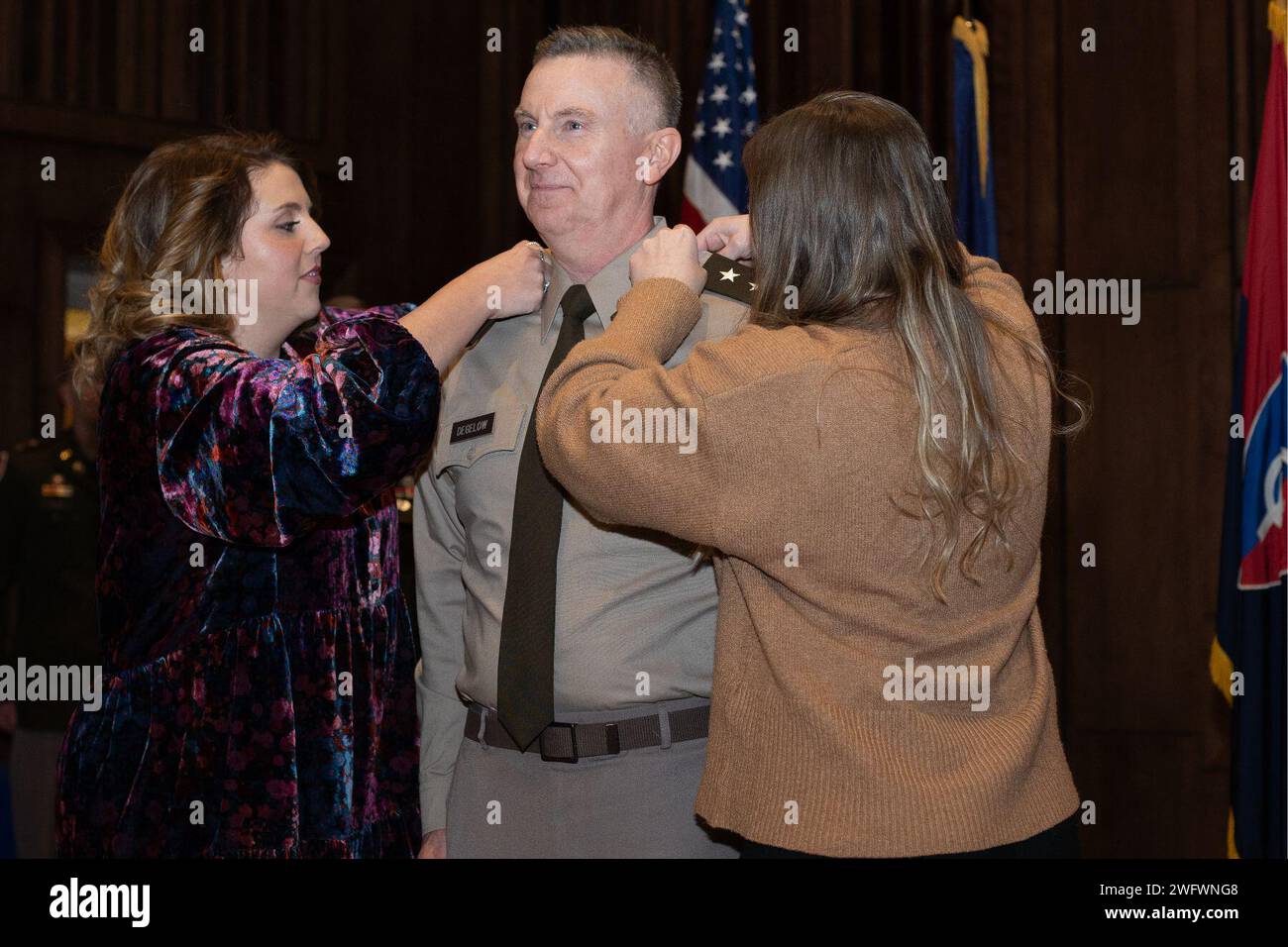 Indiana National Guard Maj. Gen. Dan Degelow, center, receives his two ...