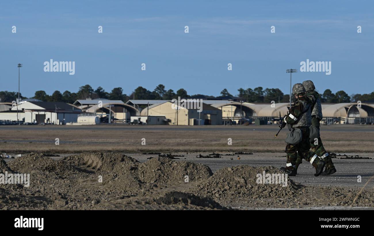 U.S. Airmen assigned to the 4th Civil Engineer Squadron perform a sweep ...