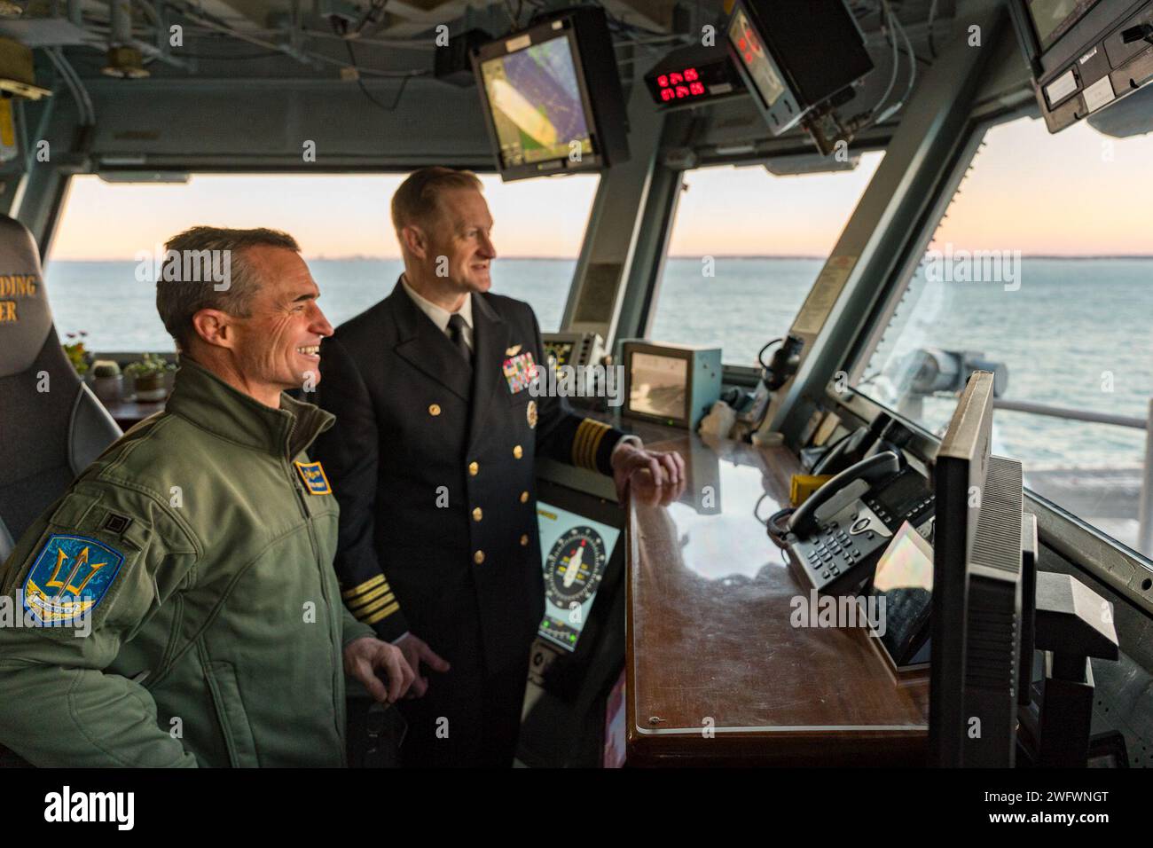 Vice Adm. Doug Perry, commander, U.S. 2nd Fleet, speaks with Capt. Rick ...