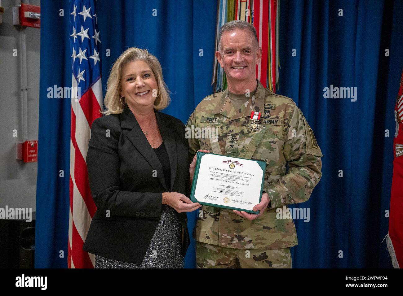 Secretary of the U.S. Army Christine E. Wormuth, left, presents the ...