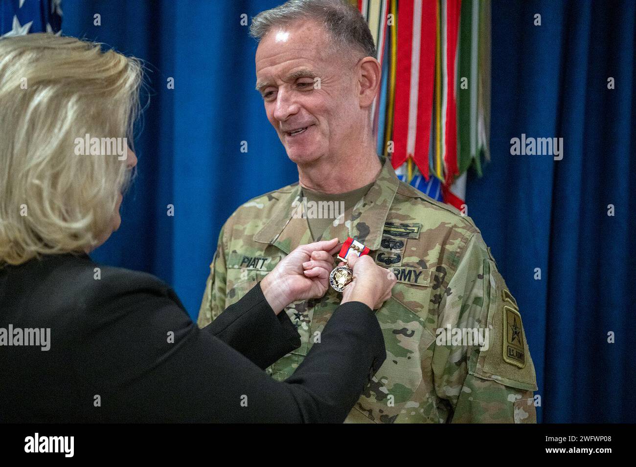 Secretary of the U.S. Army Christine E. Wormuth, left, presents the ...