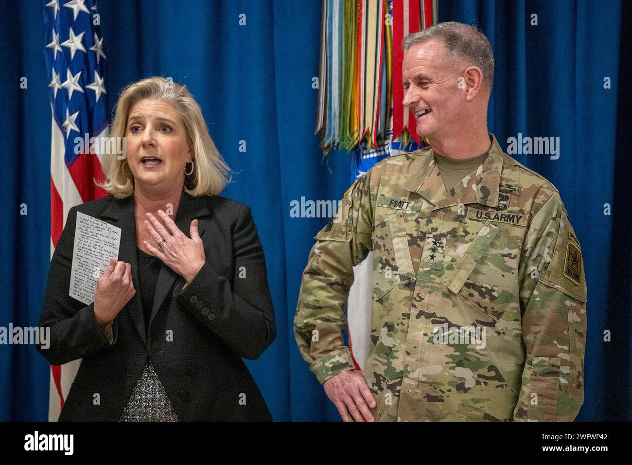 Secretary of the U.S. Army Christine E. Wormuth, left, gives her ...