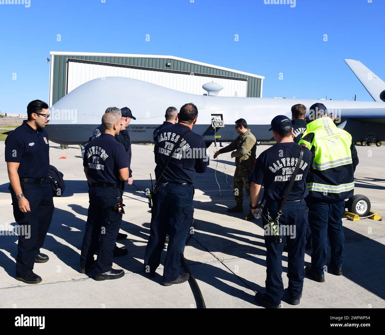 A member of the 147th Attack Wing Aircraft Maintenance Squadron gives a ...