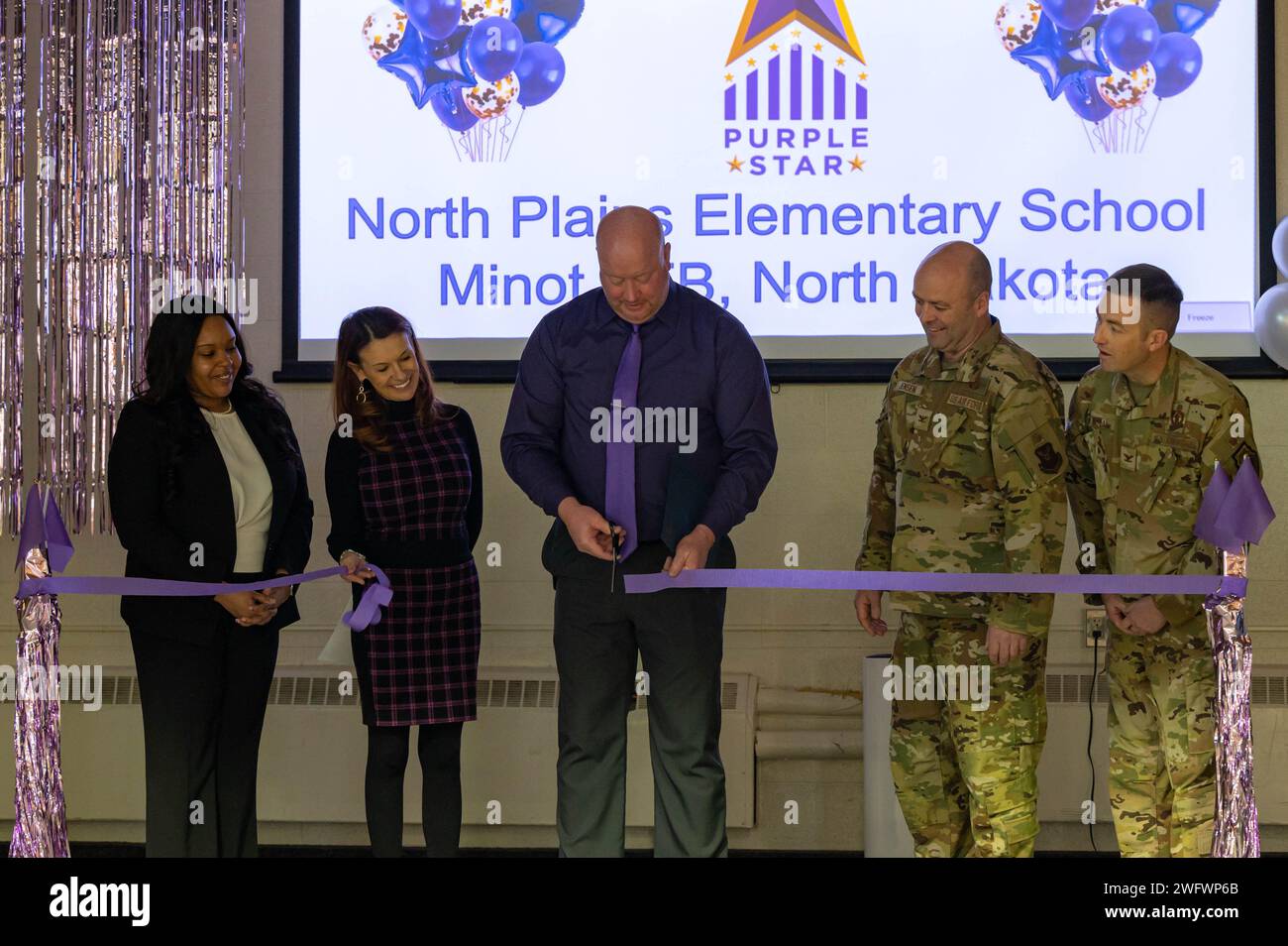 The Purple Star Award is presented to Ned Strand, North Plains elementary school principal, at ...