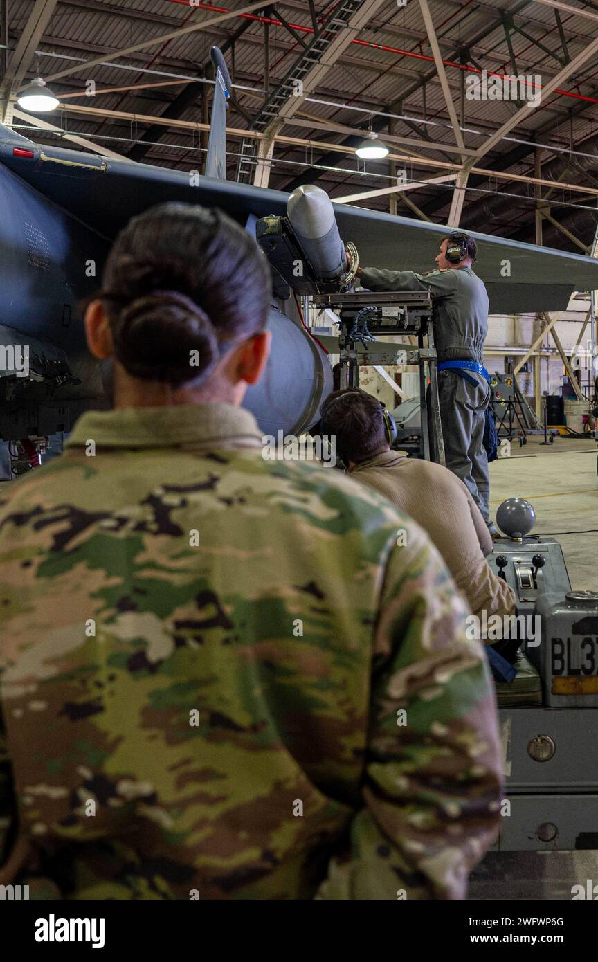 U.S. Airmen assigned to the 492nd Fighter Generation Squadron load a ...