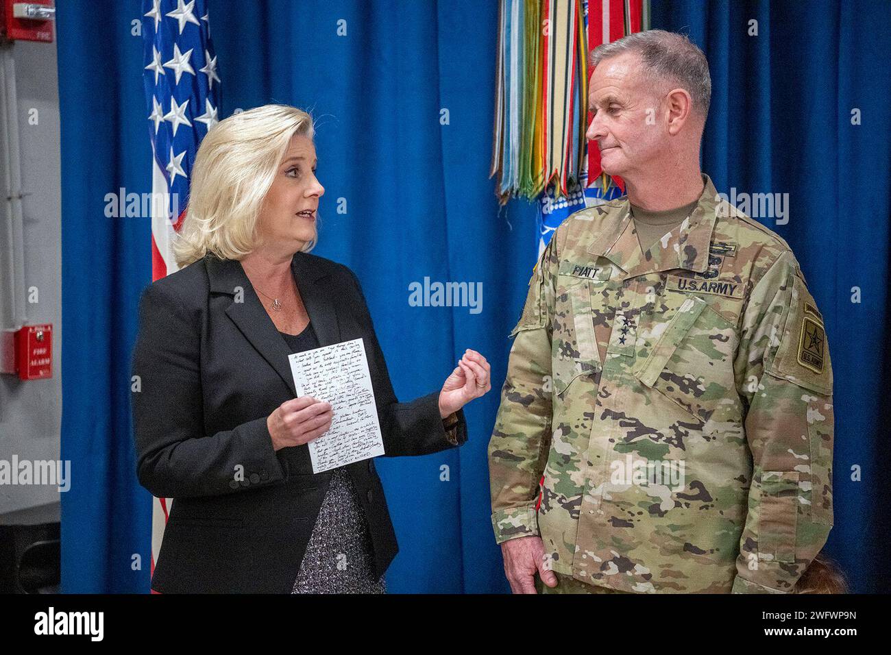 Secretary of the U.S. Army Christine E. Wormuth, left, gives her ...