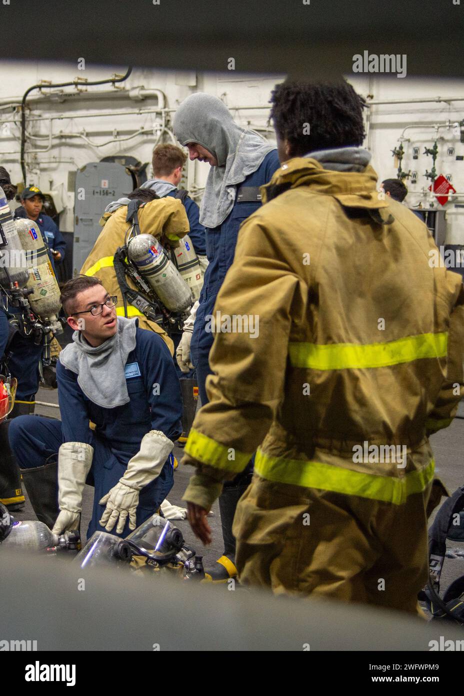 PACIFIC OCEAN (Jan. 18, 2024) U.S. Sailors stow gear after a general ...