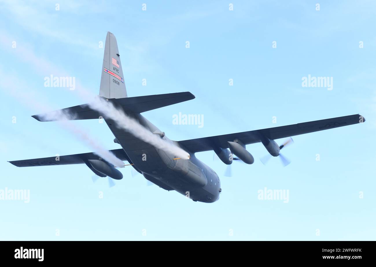 A 910th Airlift Wing aerial spray modified C-130H Hercules sprays water ...