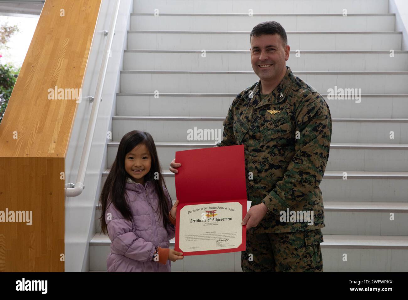 A student from Matthew C. Perry Elementary School, left, poses for a ...