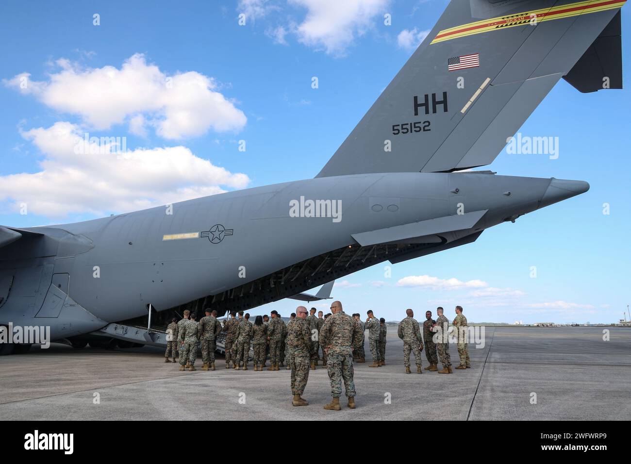 U.S. Marines with III Marine Expeditionary Force tour a U.S. Air Force C-17 Globemaster III ...