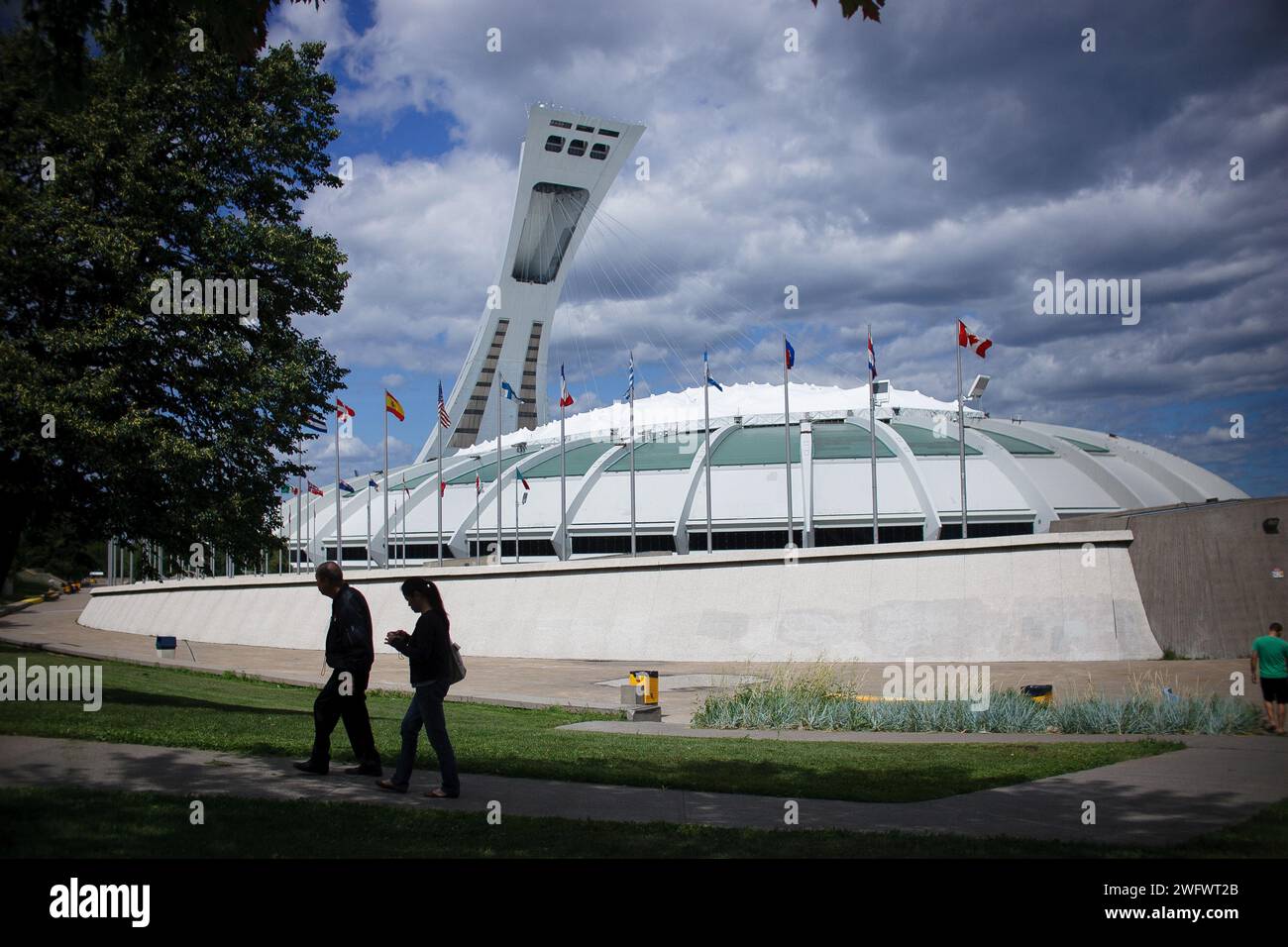 People walk past the Olympic Stadium in Montreal, Quebec, Canada Stock ...