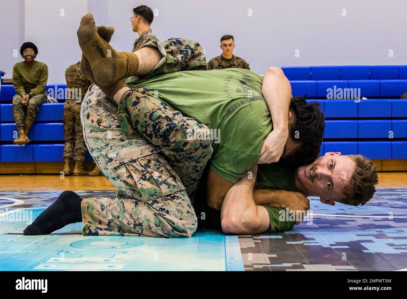 U.S. Marine Corps Sgt. Chase Short, bottom, an aviation intelligence ...