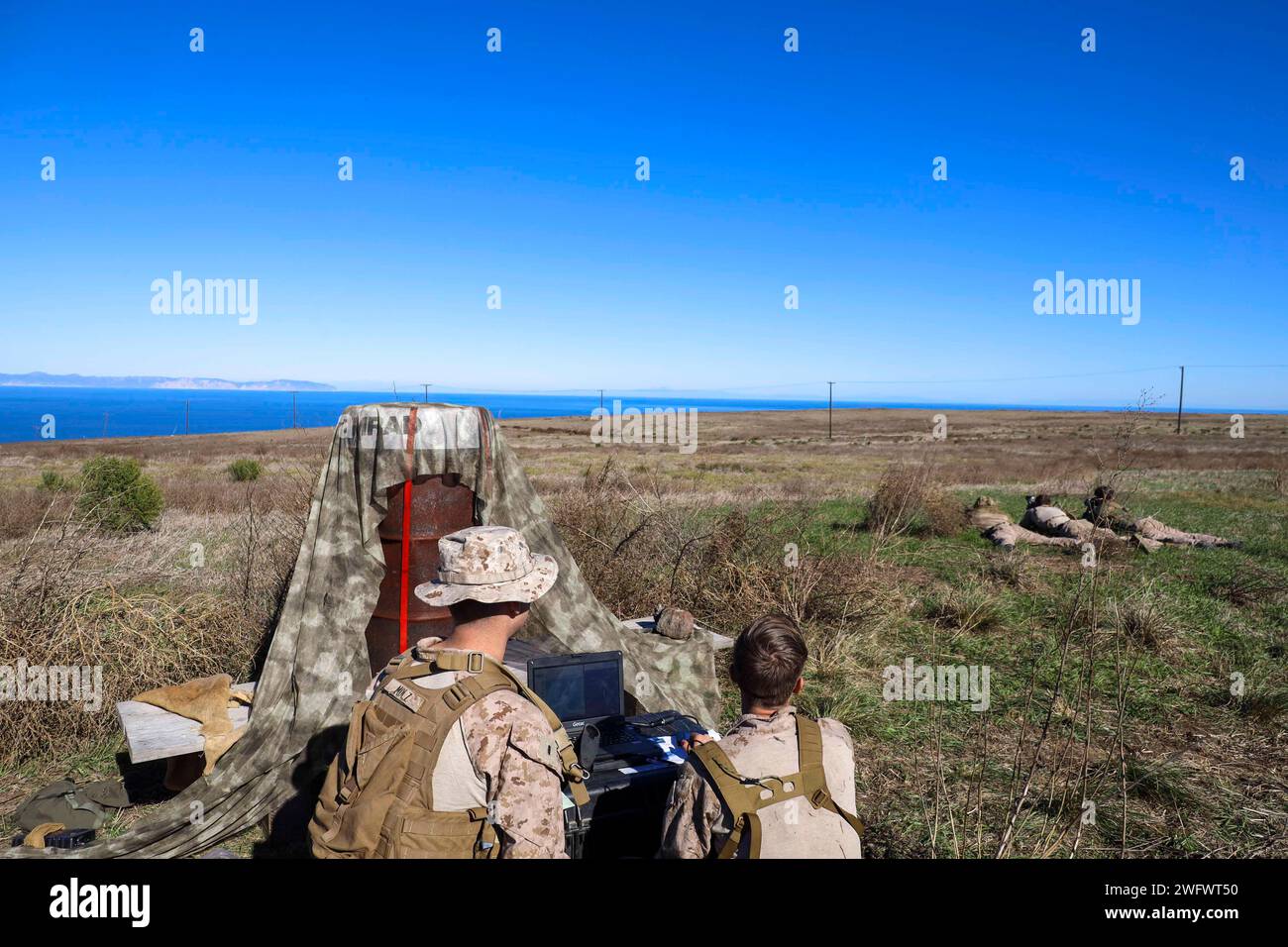 U.S. Marines assigned to the 15th Marine Expeditionary Unit monitor the ...