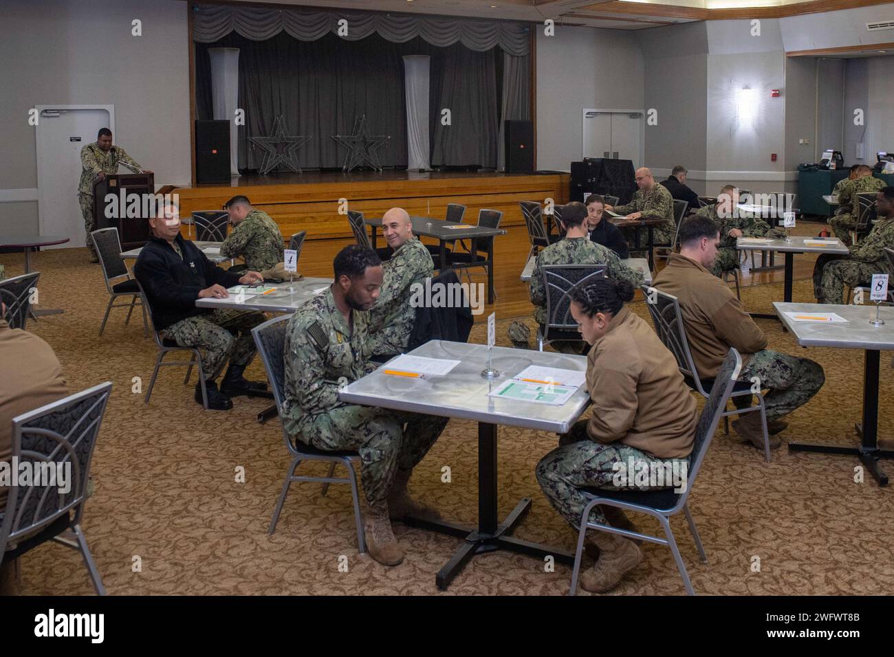 Chief Master-at-Arms Robert Kelly provides instructions for a group of ...