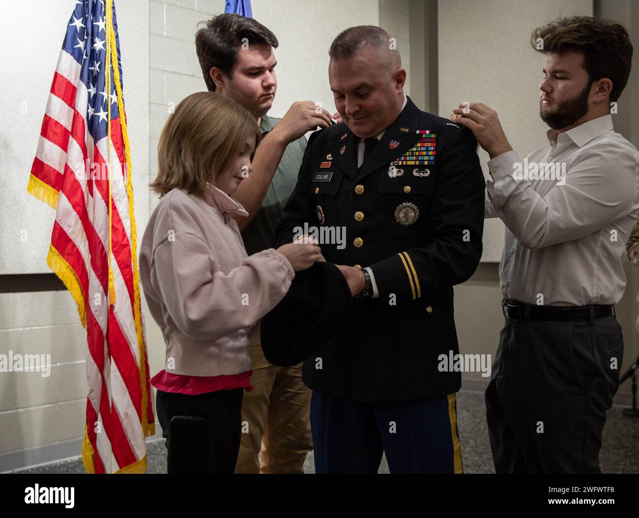 Chief Warrant Officer Four Timothy Collins' children pin on his ranks ...
