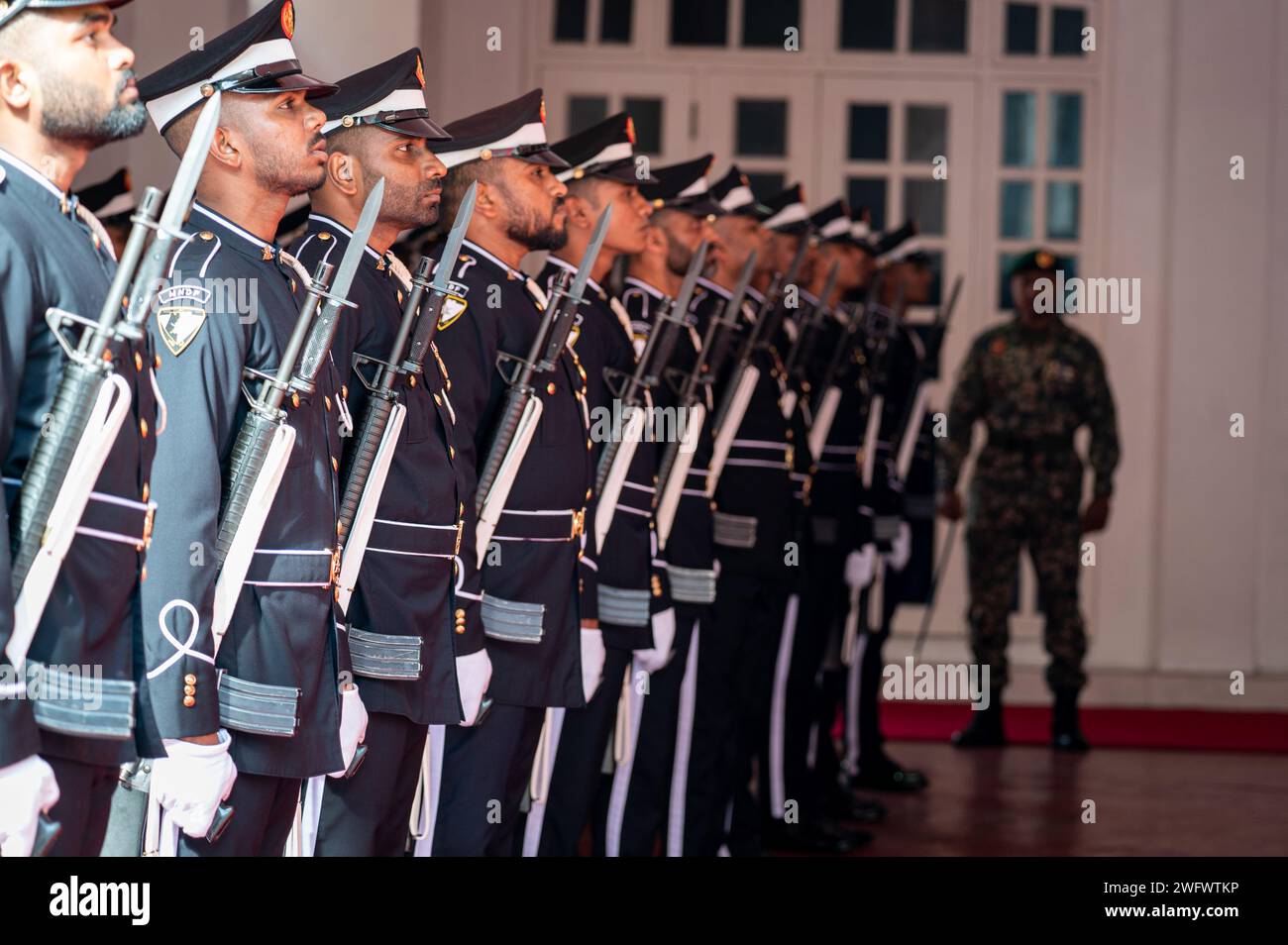 Members of the Maldives National Defence Forces (MNDF) stand at ...