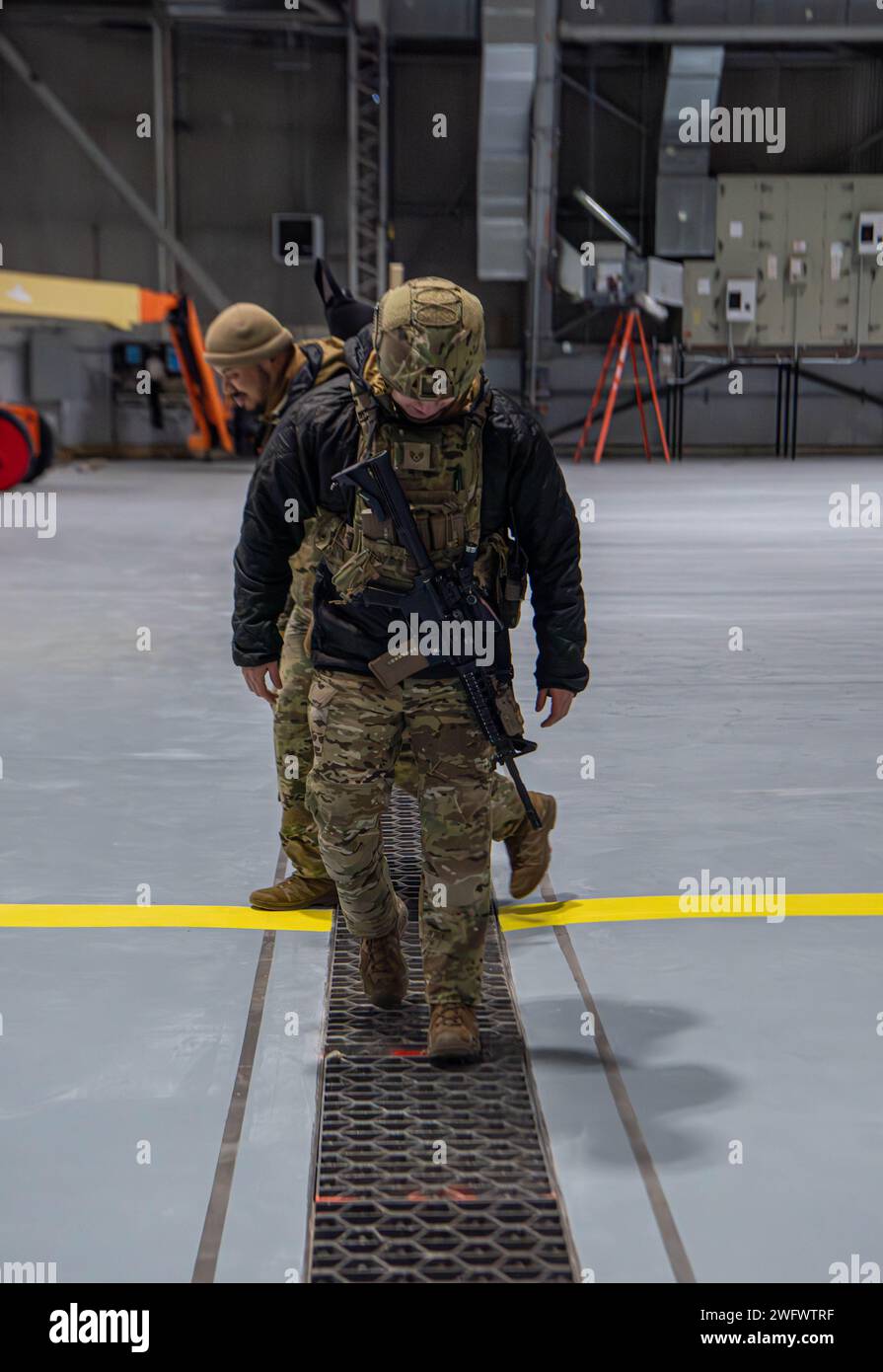 A defender from the 5th security Forces Squadron performs a security ...