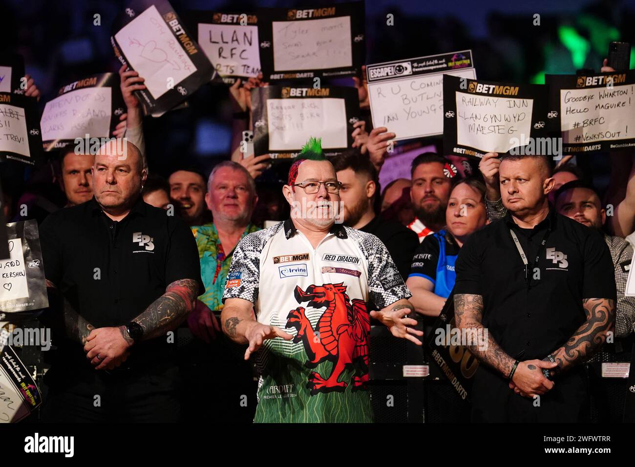 Peter Wright walks out to play Rob Cross (not pictured) during night ...