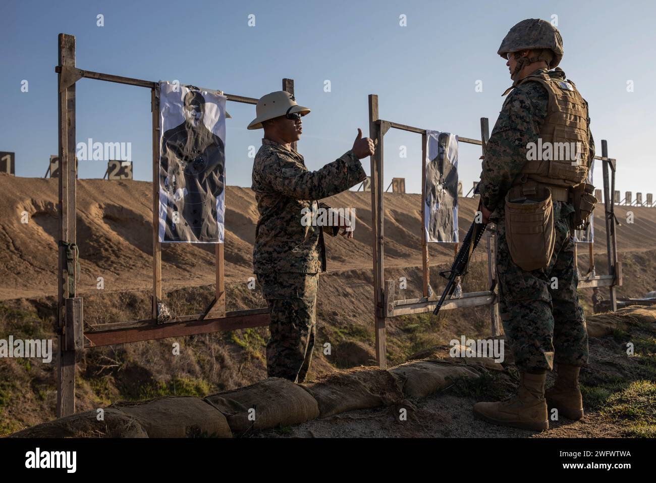 U.S. Marine Corps primary marksmanship instructor Cpl. Carvay Smith, a ...