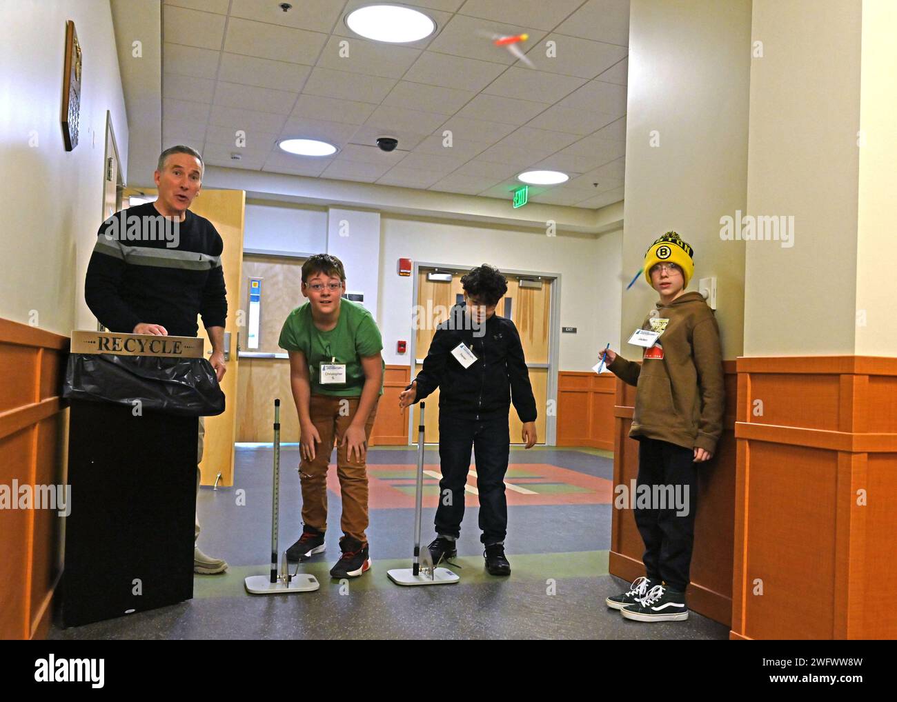 From left, STARBASE instructor Chris Ginty supervises an air-powered ...