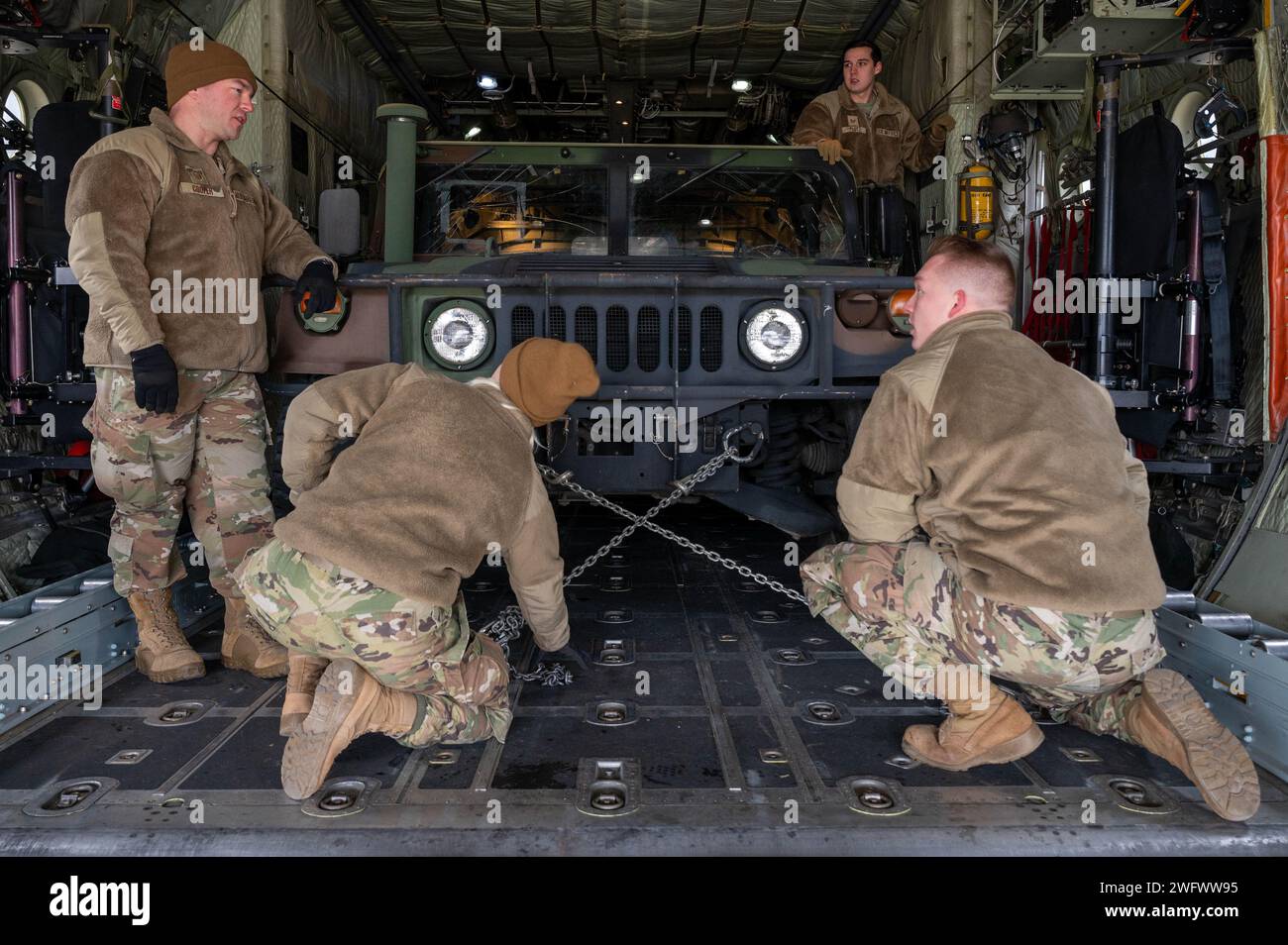 Members the 32nd Aerial Port Squadron secure a High Mobility ...