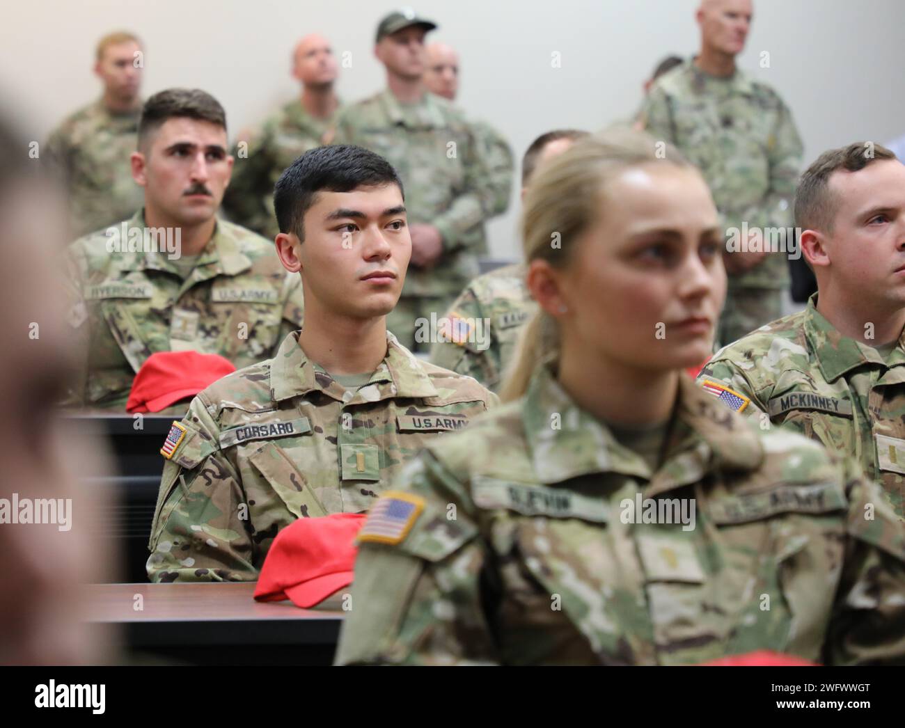 2nd Lt. Jacob M. Corsaro listens as his father, Chief Warrant Officer 5 ...