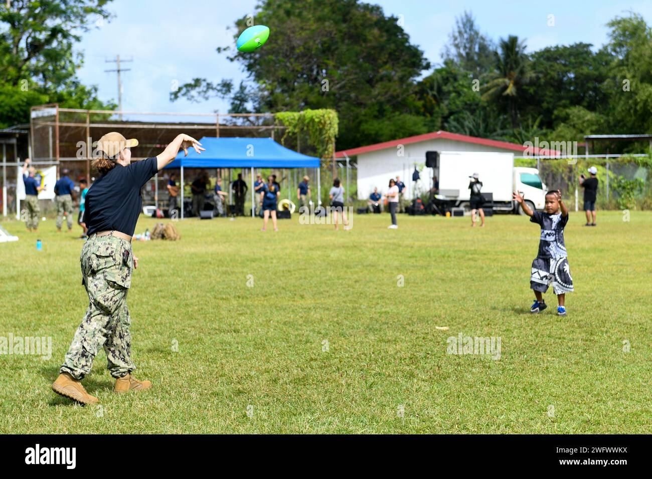 U.S. Navy Cmdr. Cheryl Collins, from Cumming, Georgia, throws a ball ...