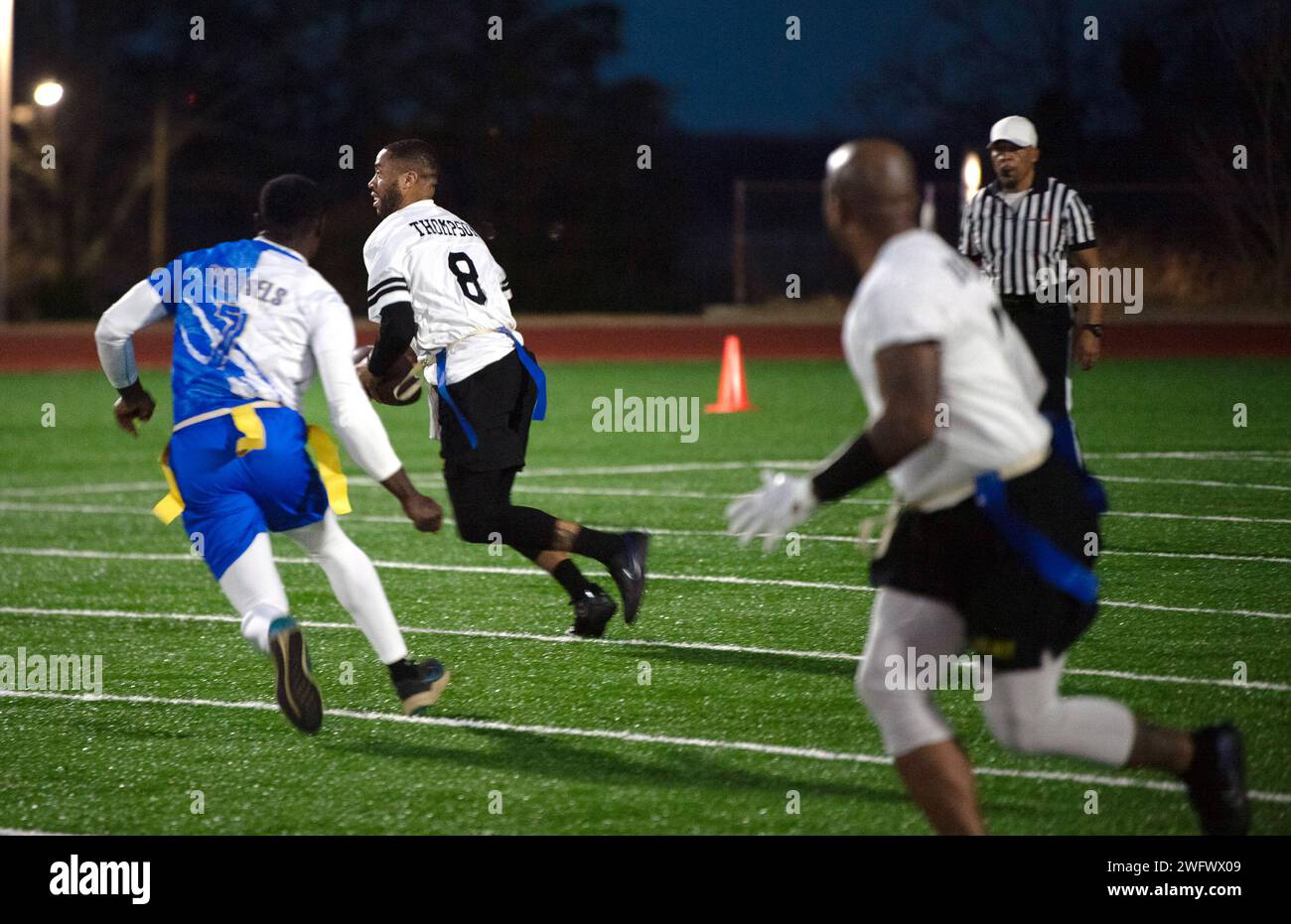 Robert Thompson, quarterback of a flag football team representing Fort ...