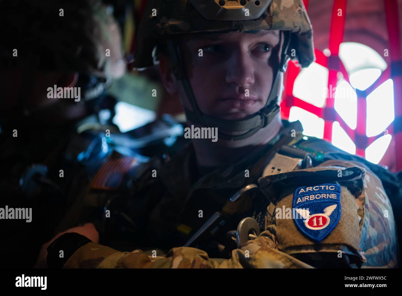 A U.S. Army 11th Airborne Division paratrooper waits for take-off ...
