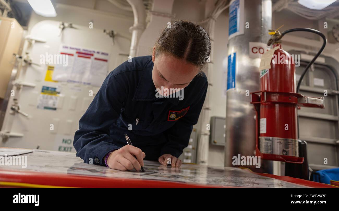 YOKOSUKA, Japan (Jan. 30, 2024) Ensign Julia Olsin tracks and plots ...