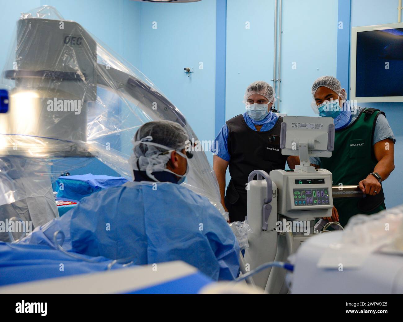 U.S. Navy Cmdr. Darren Thomas, from La Mesa, California, left, observes ...