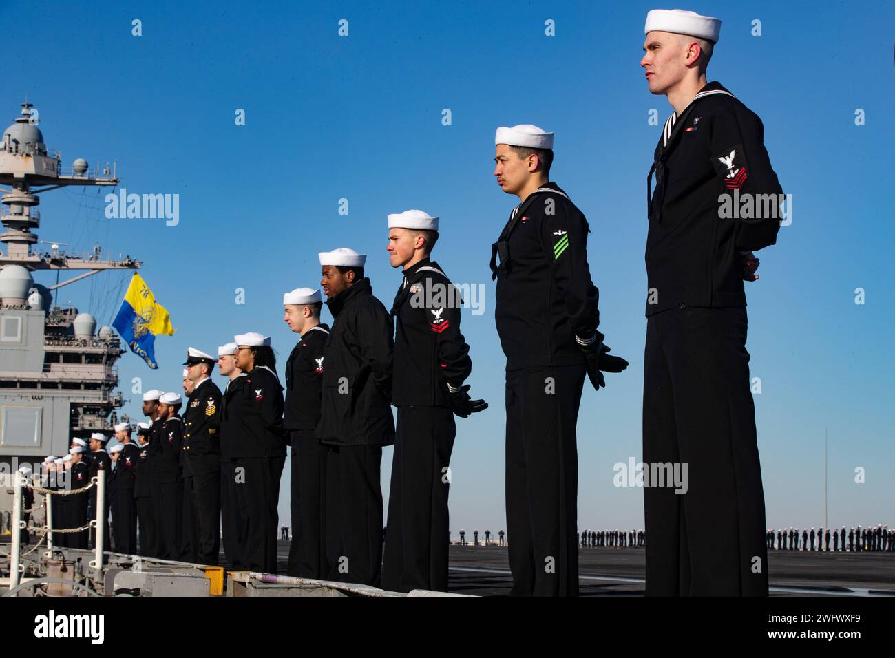 Sailors assigned to the world's largest aircraft carrier USS Gerald R. Ford (CVN 78) man the ...