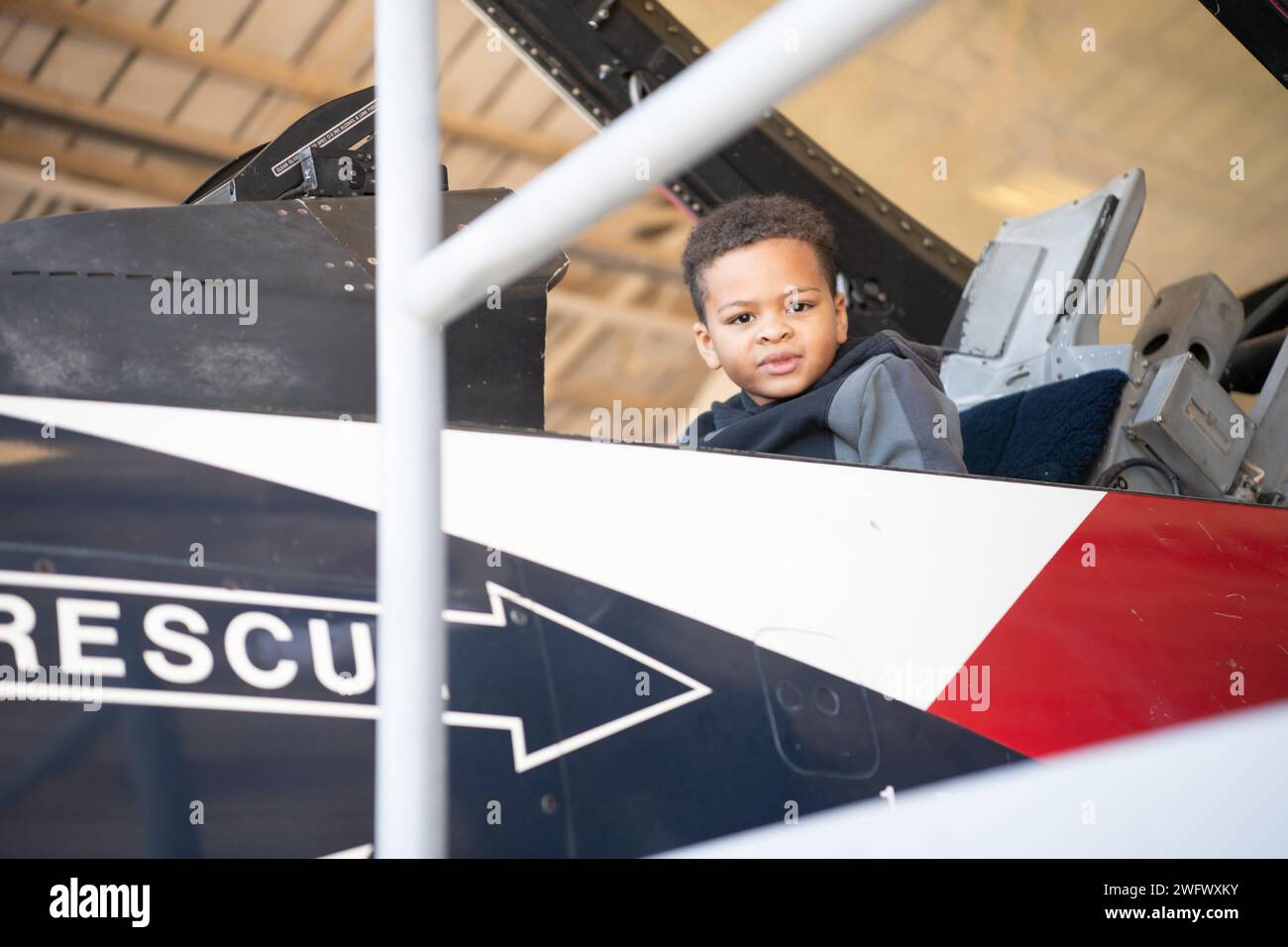 Pilot for a Day, Carter Winters poses for a photo in the cockpit of an ...