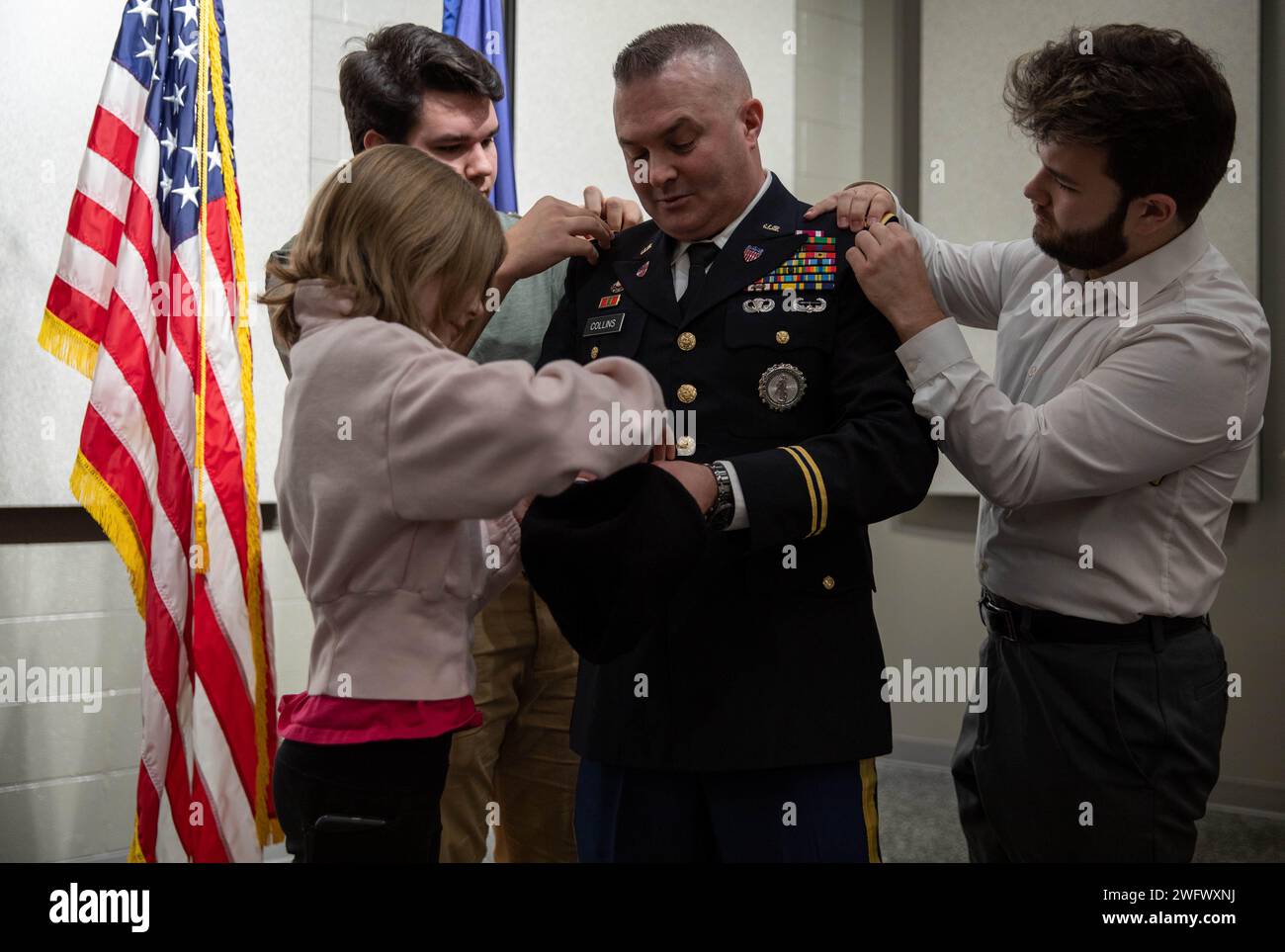 Chief Warrant Officer Four Timothy Collins' children pin on his ranks ...