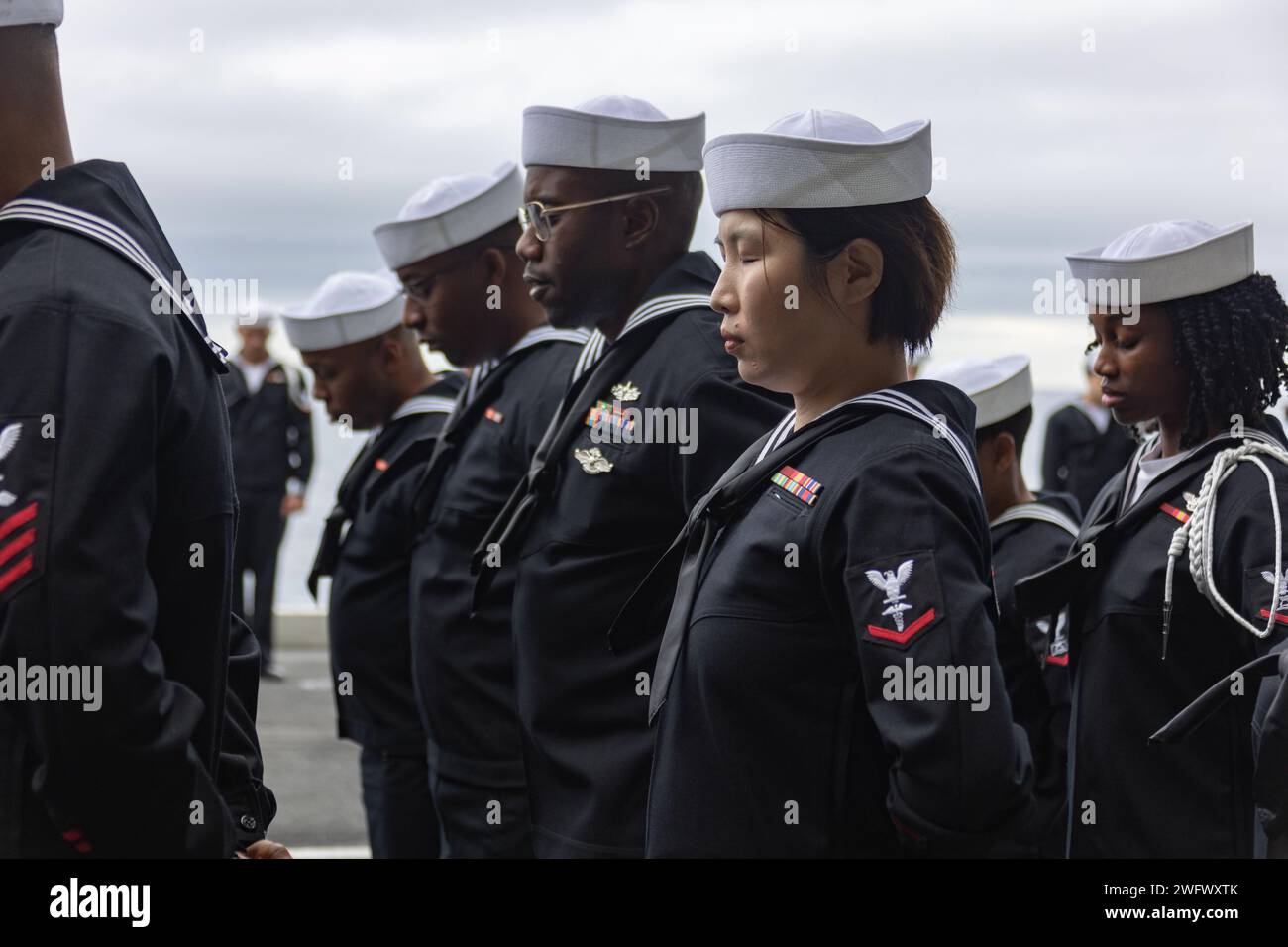 240120-N-LM220-1382 PACIFIC OCEAN (Jan. 20, 2024) Sailors bow their ...