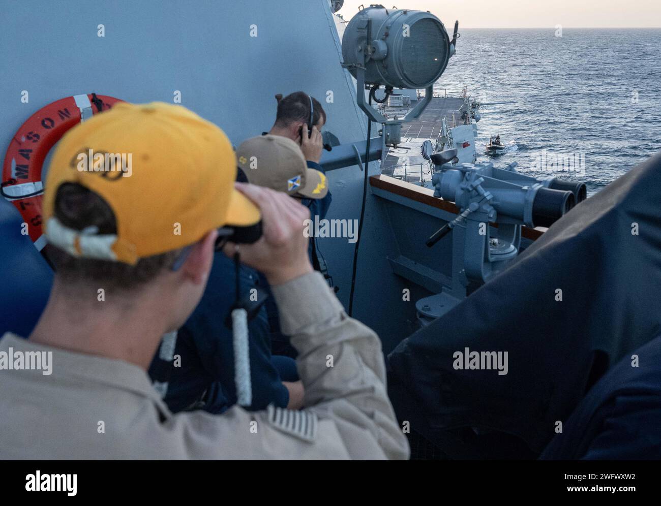240113-N-CK669-1150 RED SEA (Jan. 13, 2024) Sailors standing bridge ...