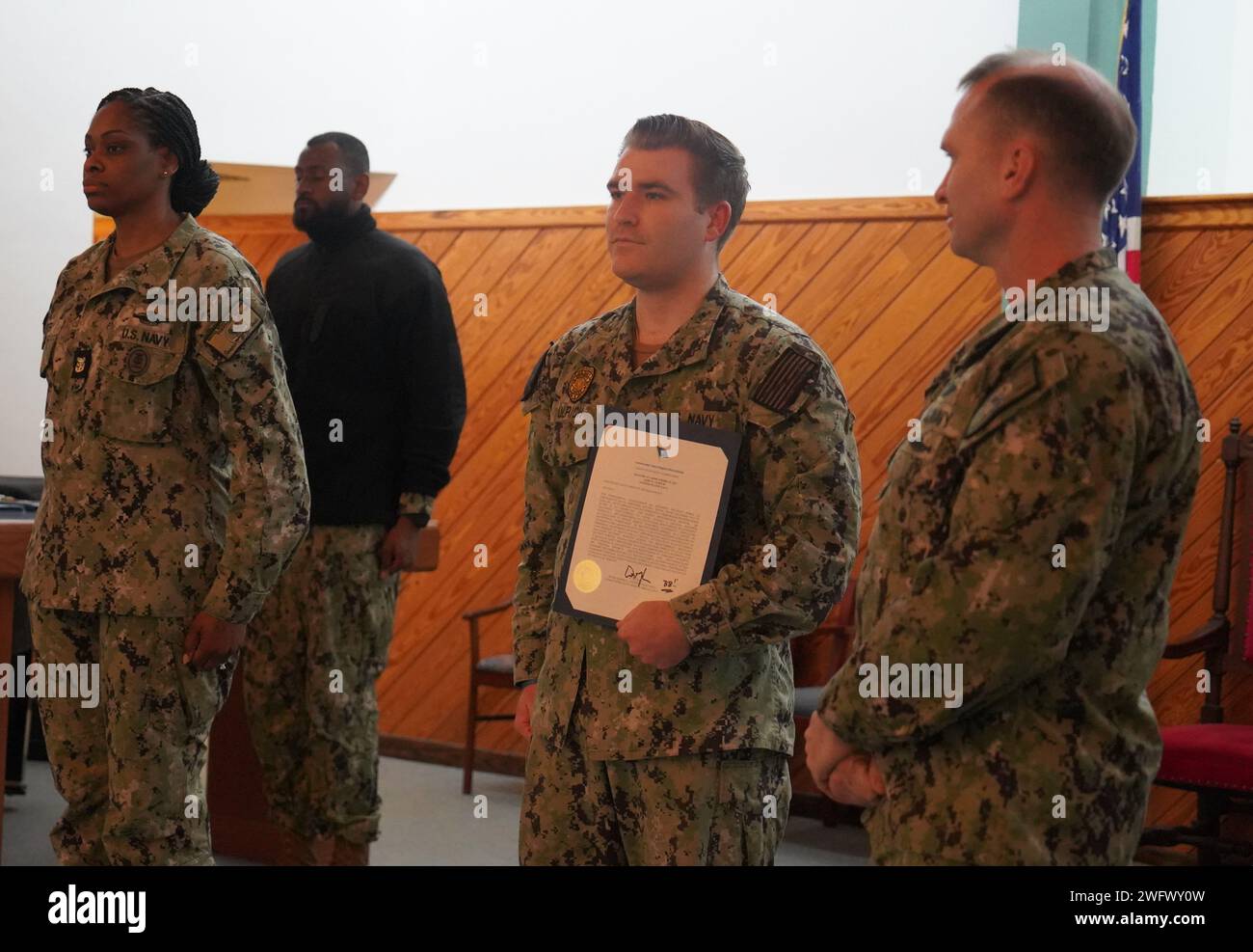 Yorktown, Va. (January 30, 2024) MA3 John Ulrich is presented with a ...