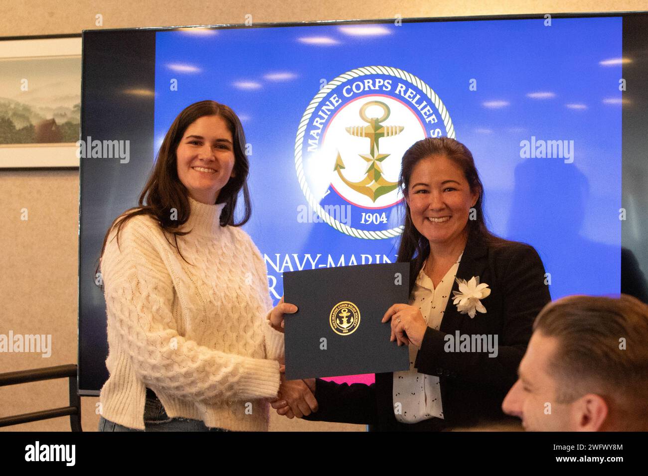 Grace Ellis, left, a volunteer with the Navy and Marine Corps Relief ...