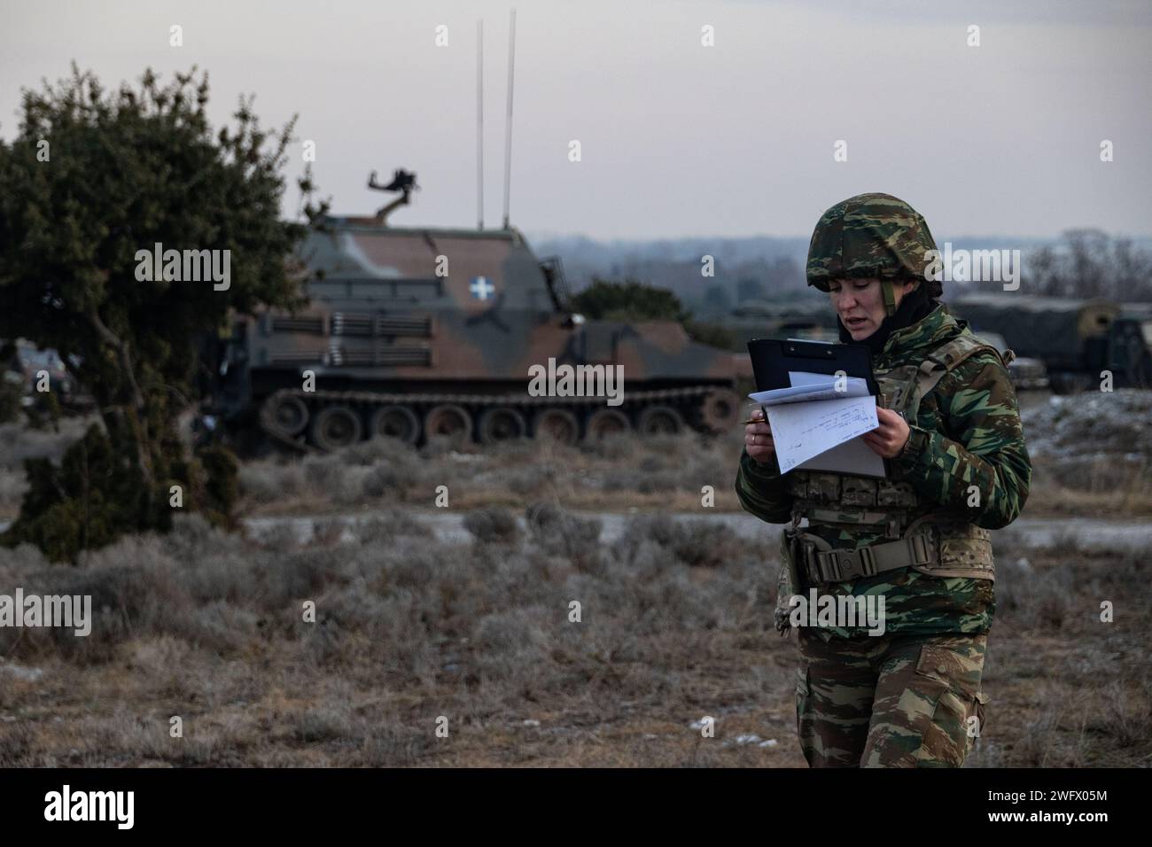 A Hellenic Marine, part of the fire direction center with the 32nd ...
