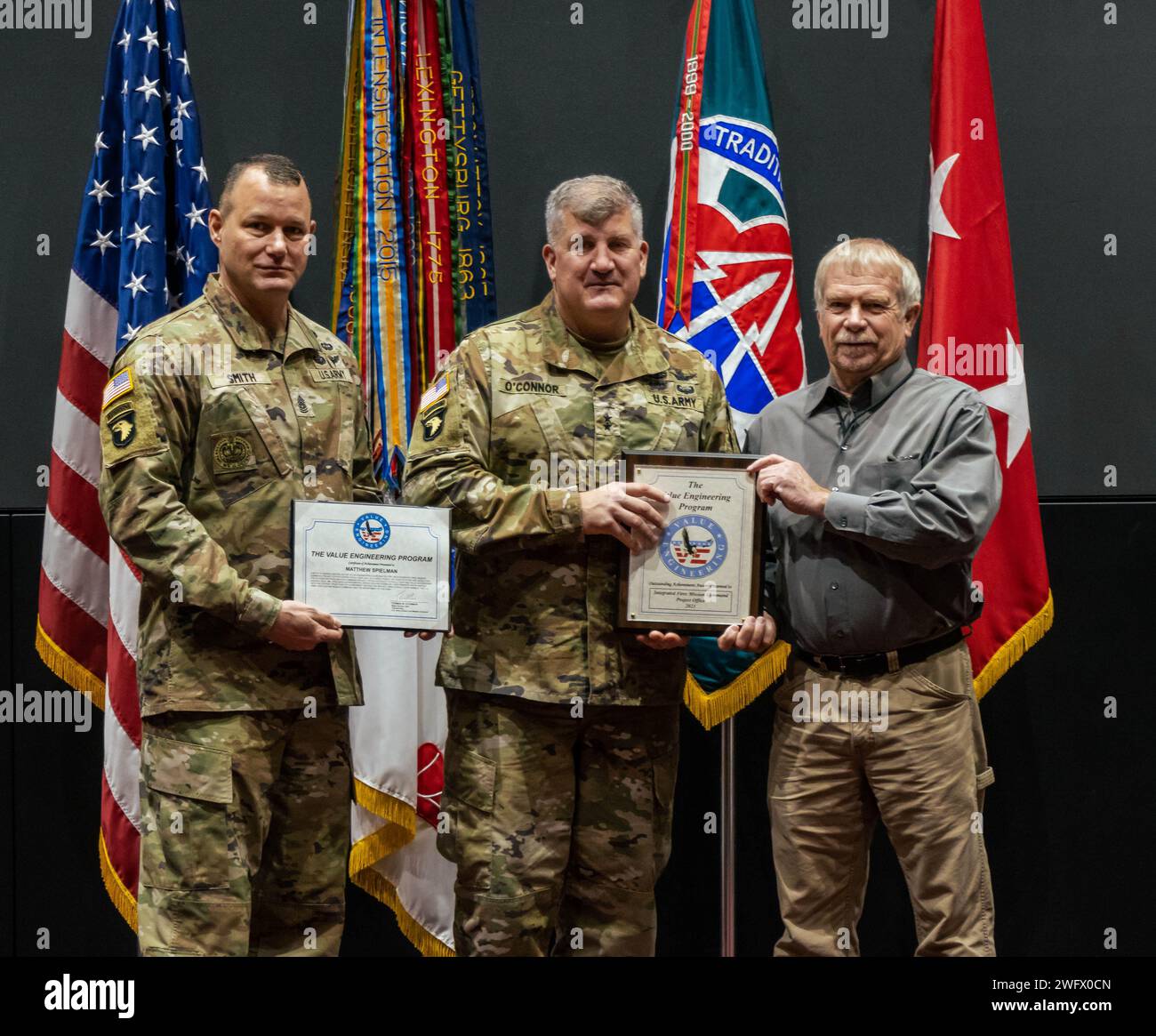 Jim Beach accepts the organization plaque and value engineering ...