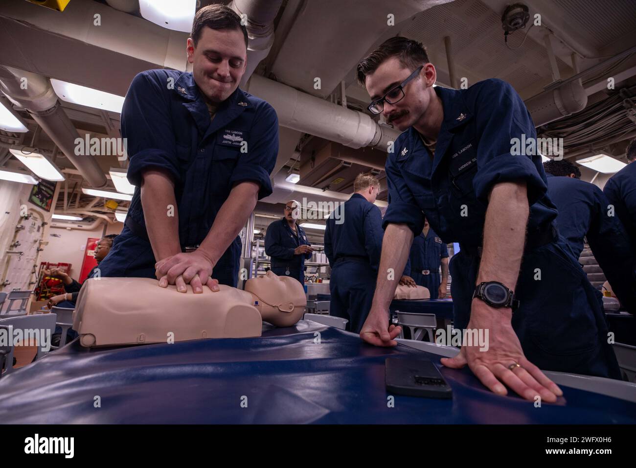 Hospital Corpsman 2nd Class Andrew Siler, right, observes Fire ...