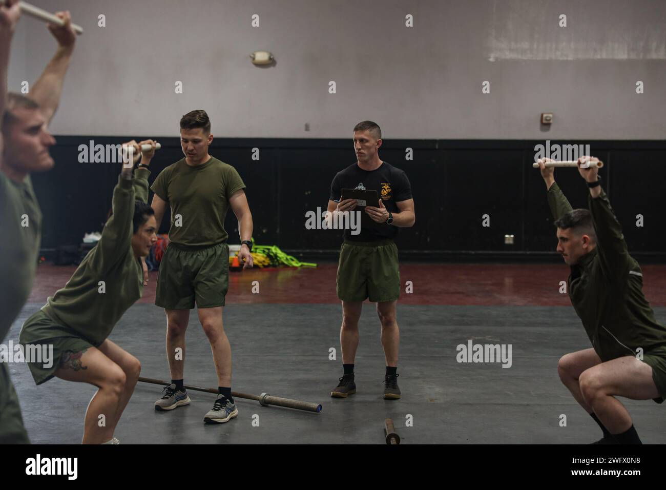 U.S. Marine Corps Gunnery Sgt. Jack Pavao, center, a Force Fitness ...