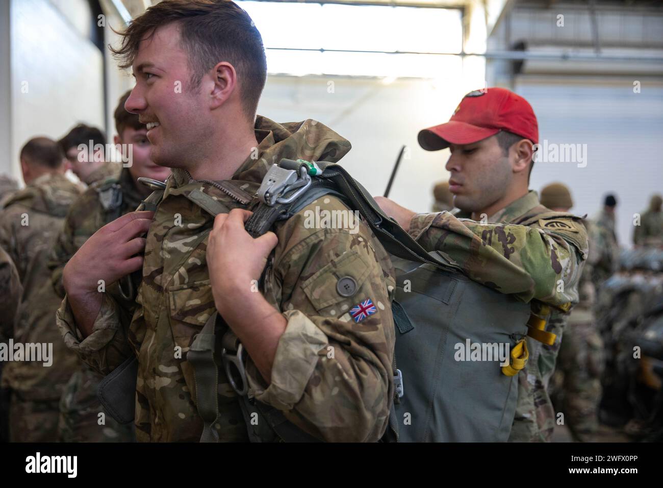 British Army paratrooper, Private Adam Stafford (left), assigned to the ...