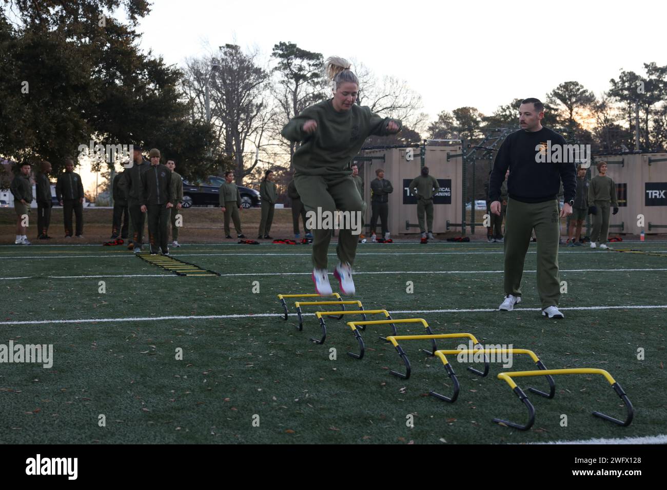 U.S. Marine Corps Sgt. Christopher Spencer, right, a Force Fitness ...