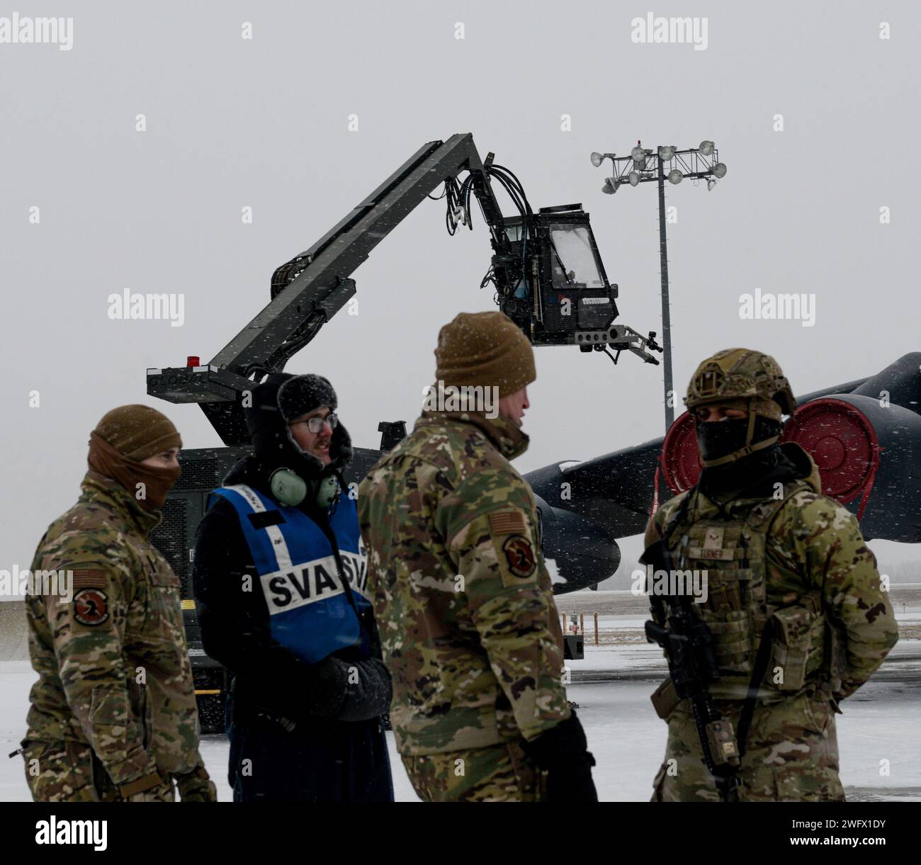 Airmen from the 5th Bomb Wing stand guard at a B-52H Stratofortress ...