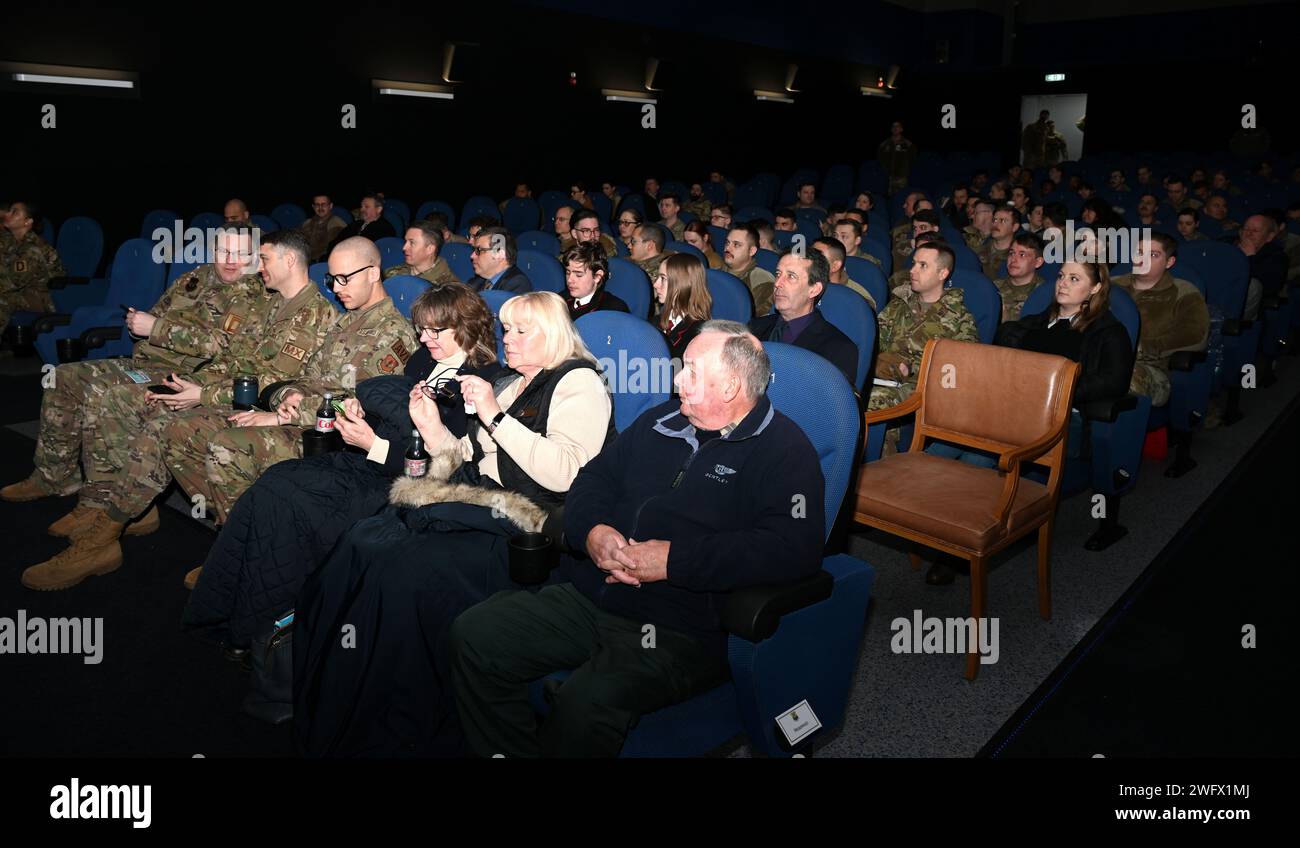 U.S. Air Force Airmen, civilians and invited guests prepare to watch a ...