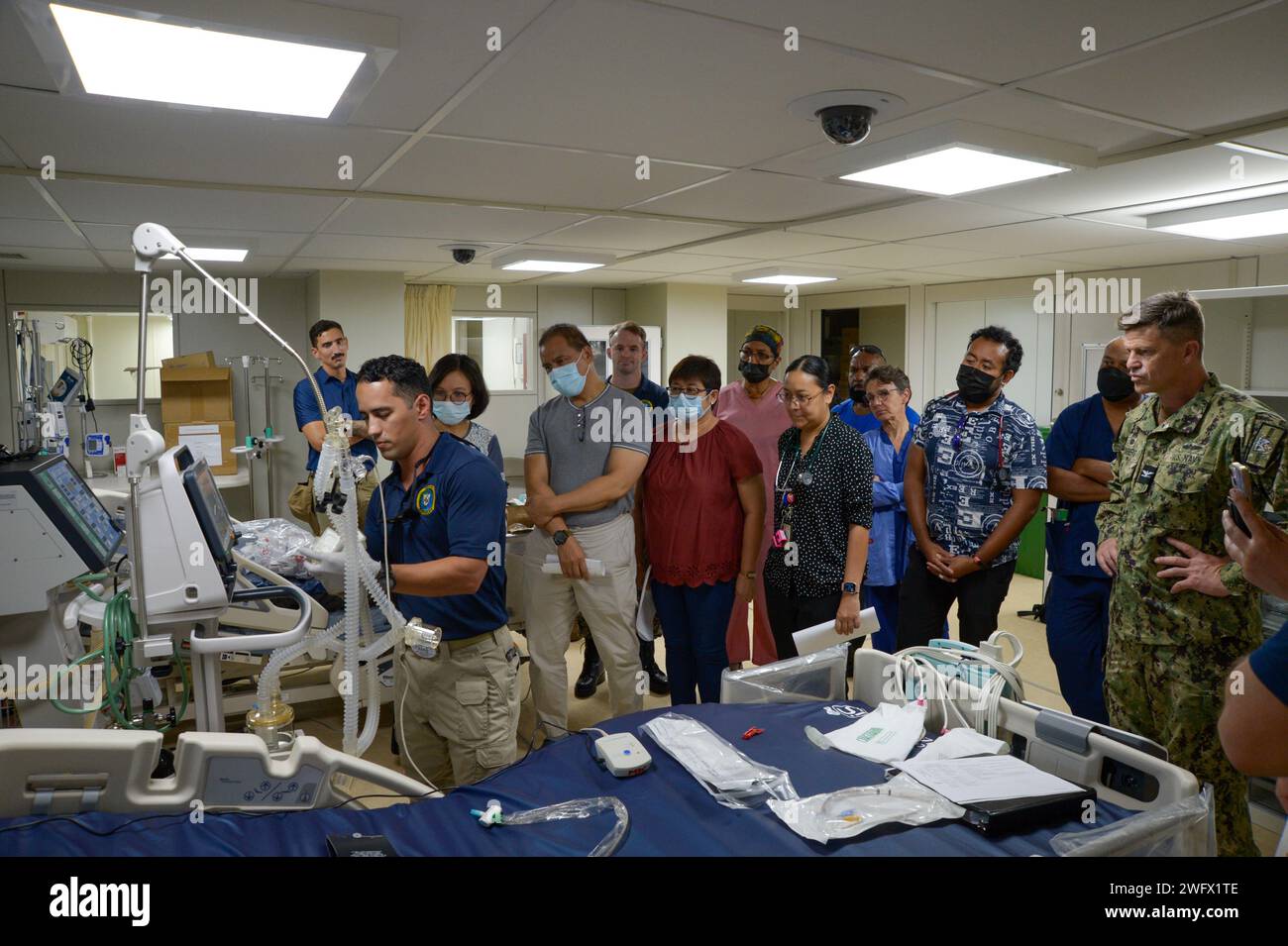U.S. Navy Chief Hospital Corpsman Christian Miranda, left, shows ...