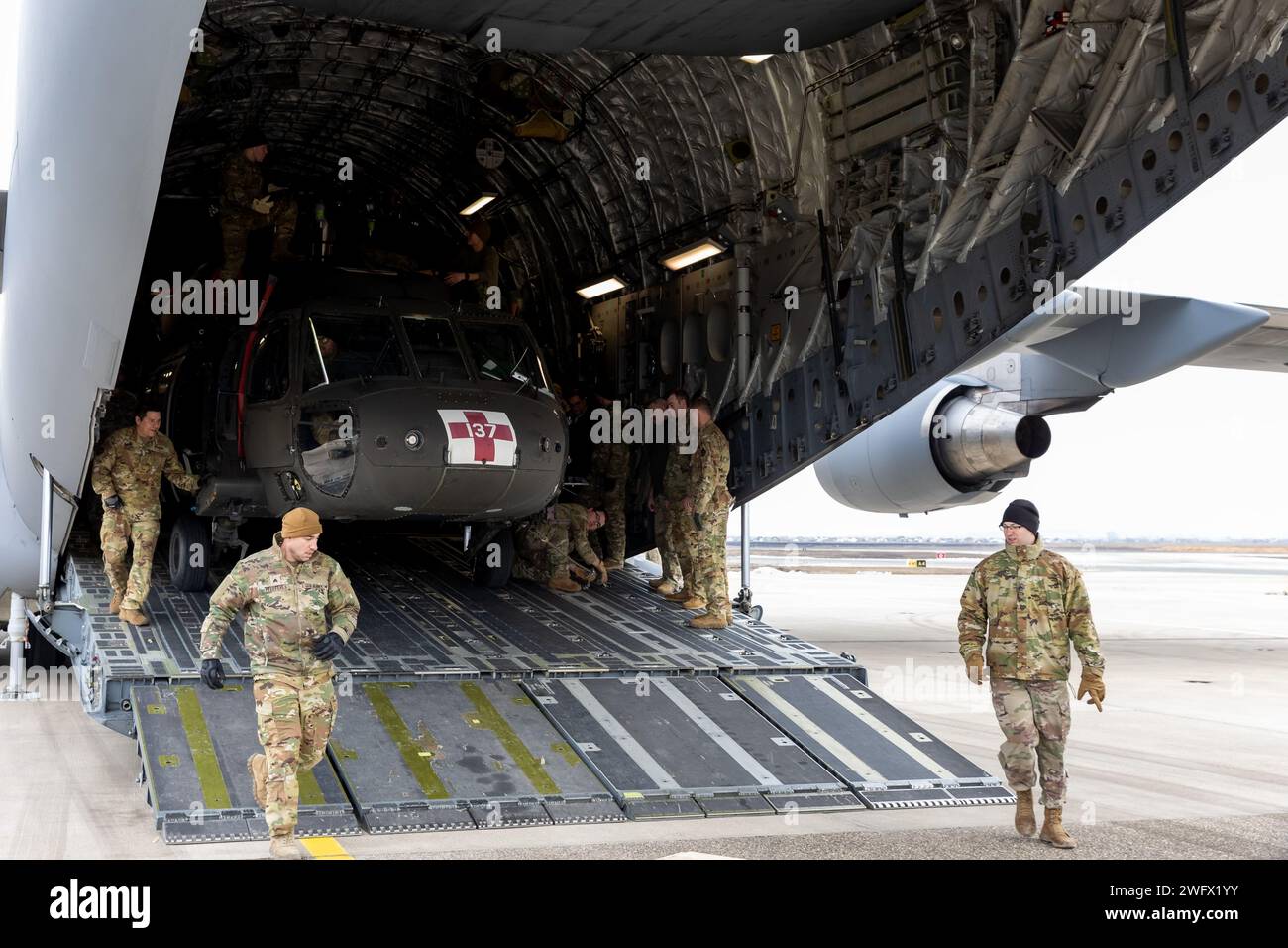 Members of 1st Battalion, 126th Aviation Regiment retrograde nine UH-60 ...